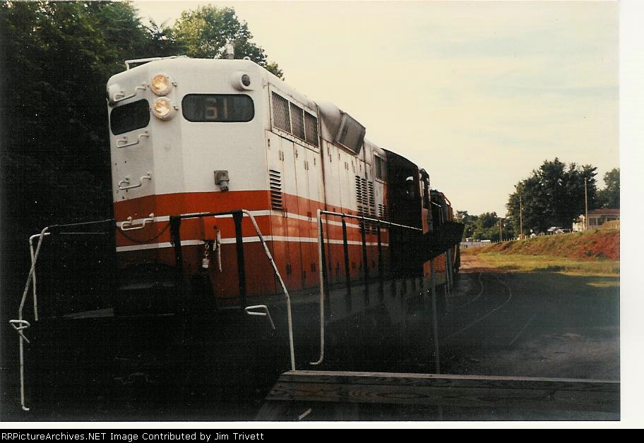 IORY 61 brings a short train by the C&O station in Jackson